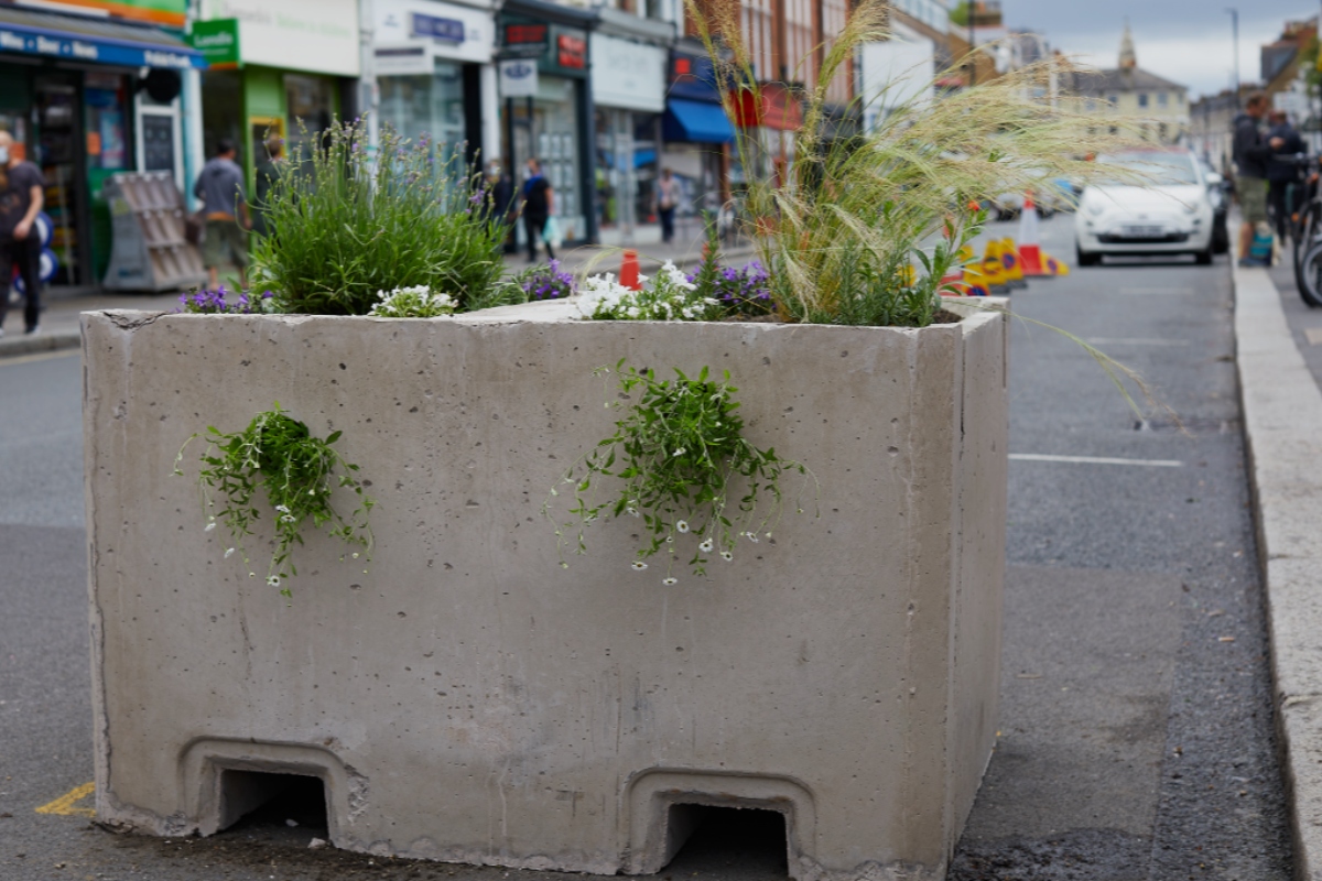 Self-watering green roadblocks help cities implement emergency ...